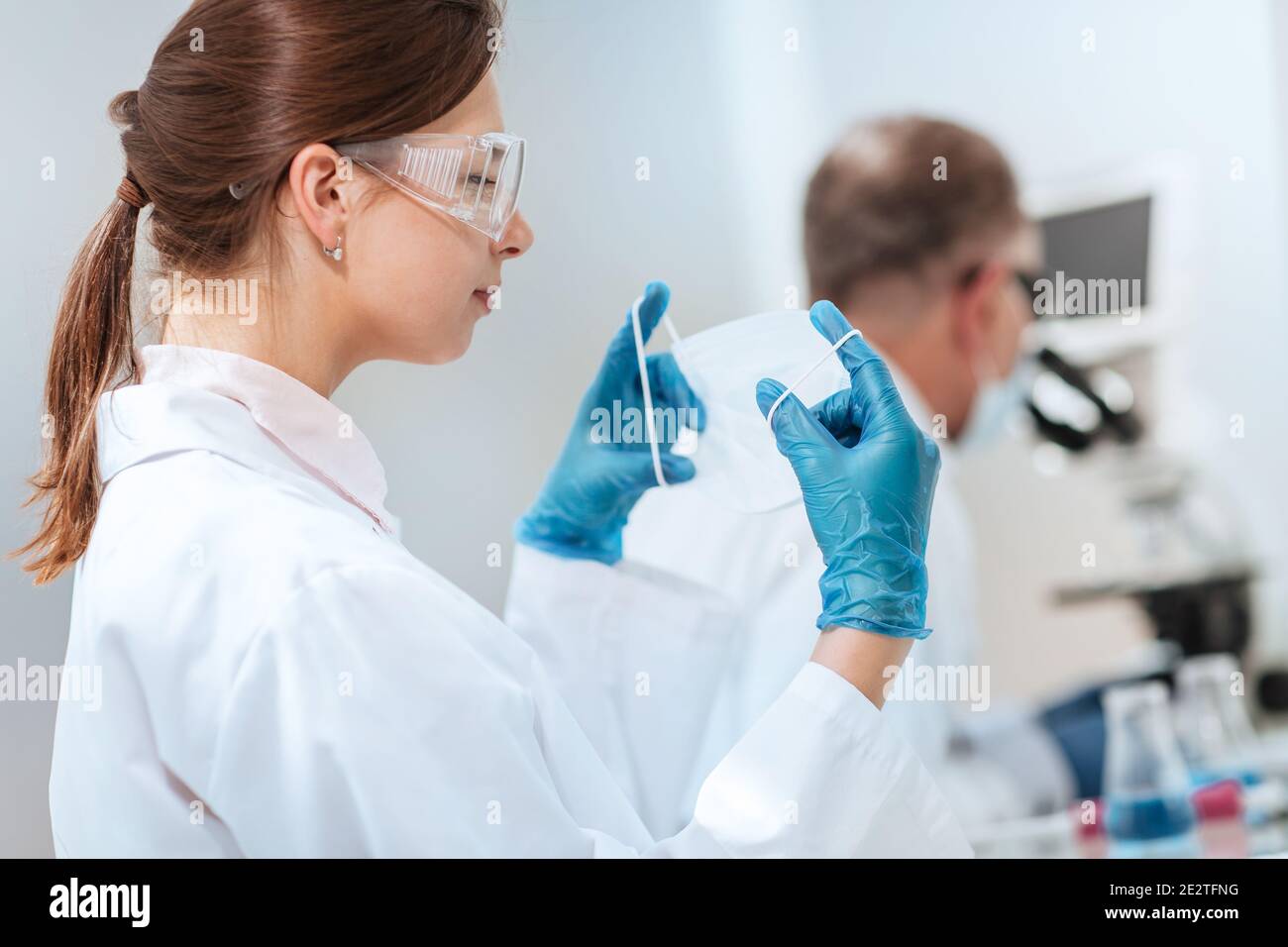 Scientist researcher putting medical hi-res stock photography and ...
