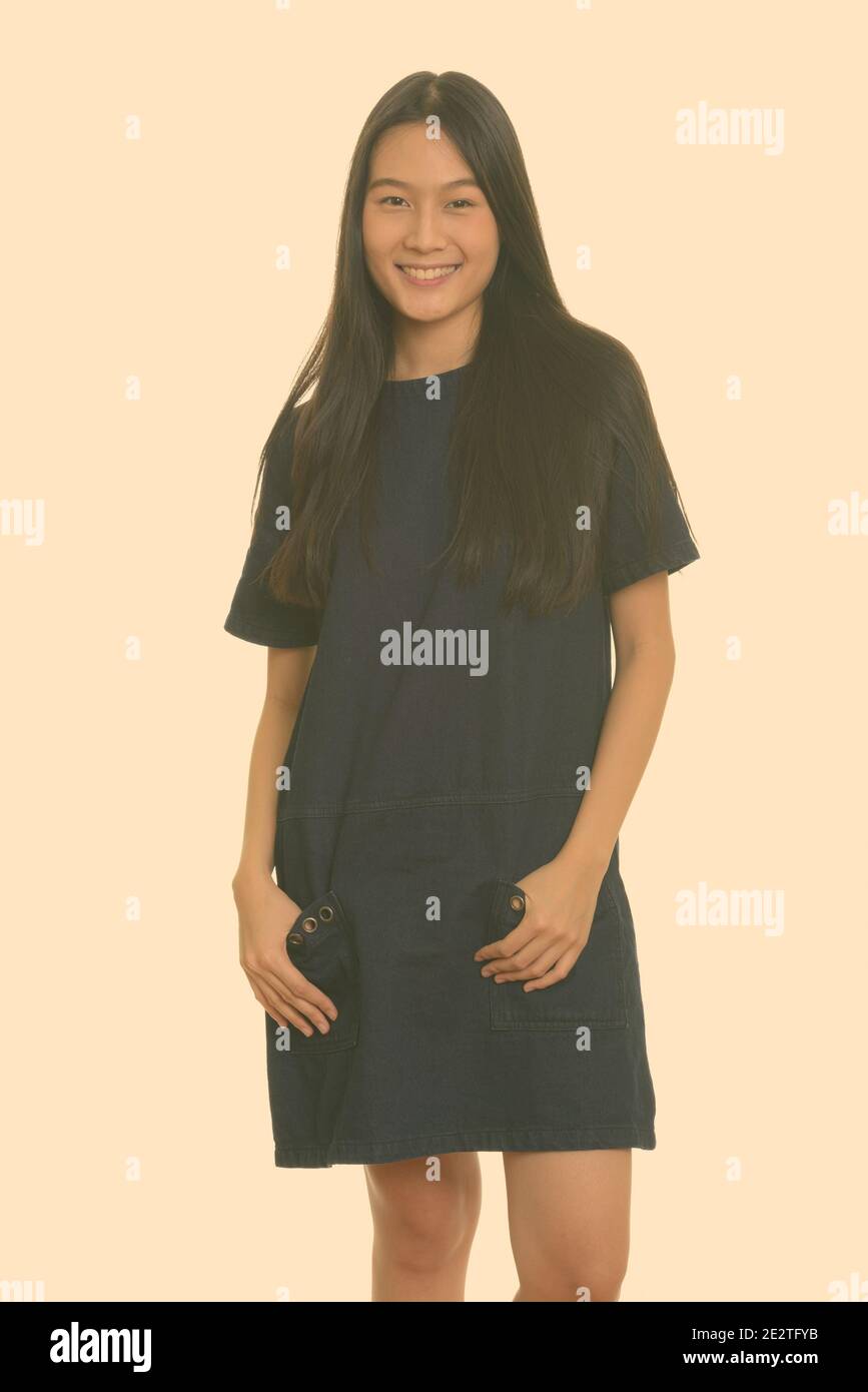 Young happy Asian teenage girl smiling Stock Photo - Alamy