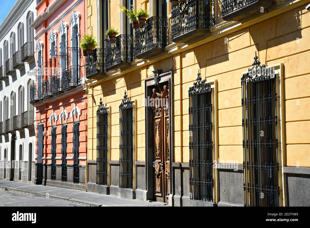Exterior view of colorful Colonial buildings on 5 de Mayo in the ...