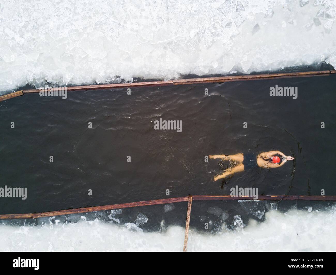 Shenyang, China. 14th Jan, 2021. A winter swimming enthusiast swims in ...