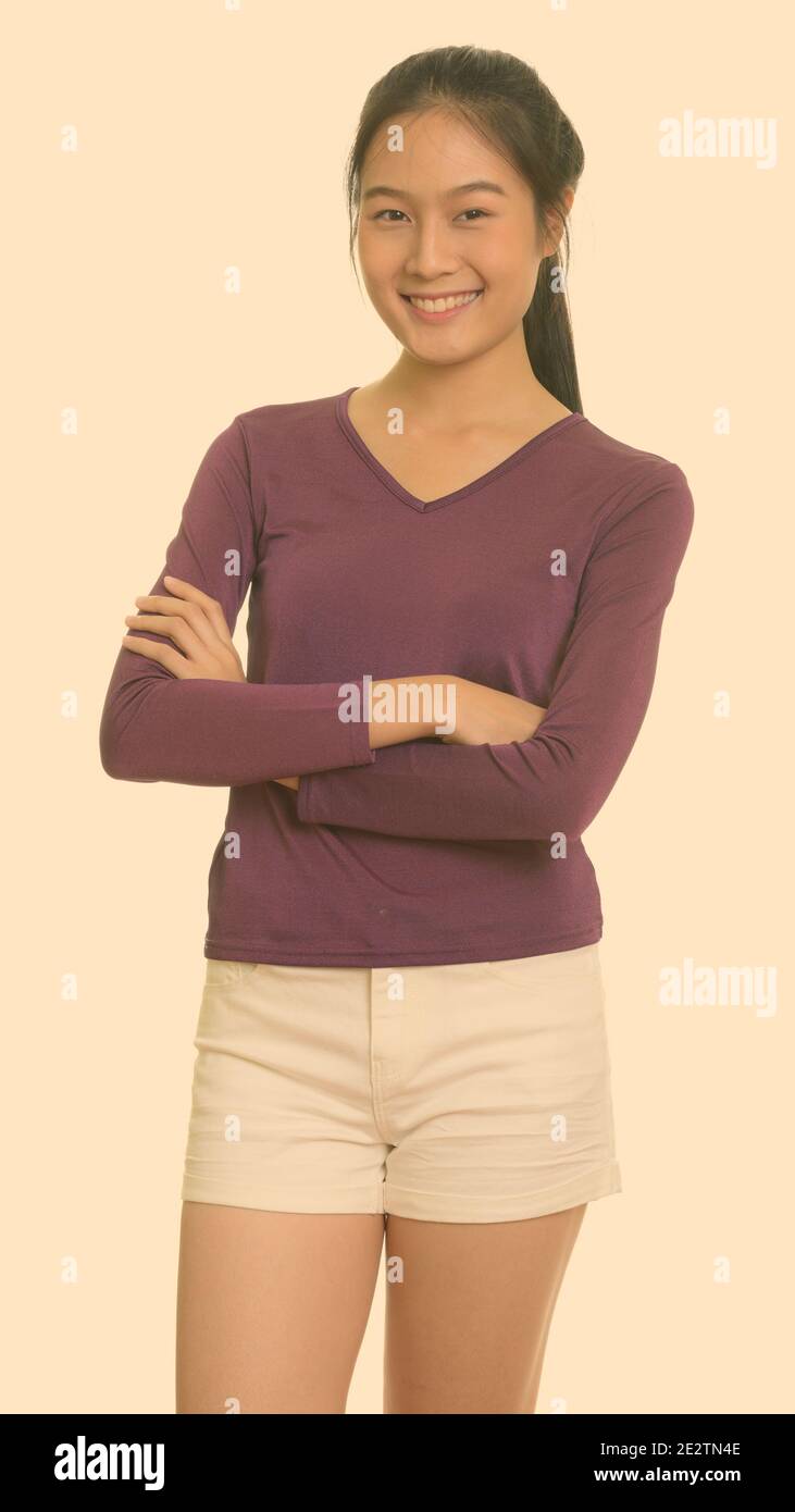 Young happy Asian teenage girl smiling Stock Photo - Alamy