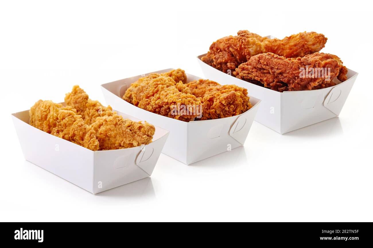 Fried breaded chicken in white cardboard boxes isolated on white ...