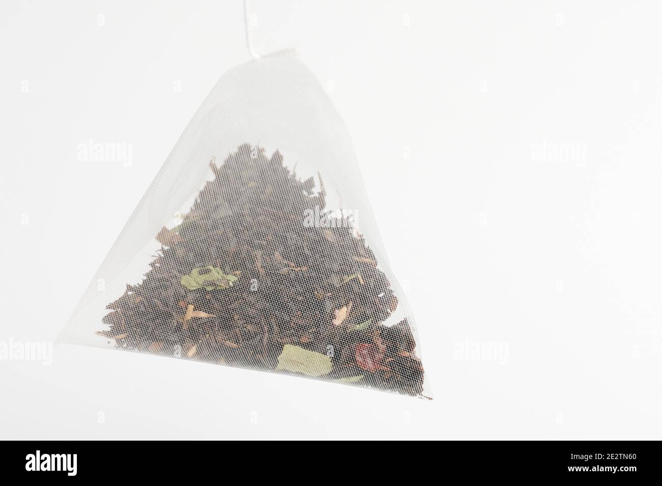 Triangle tea bag isolated on studio background close up view Stock ...