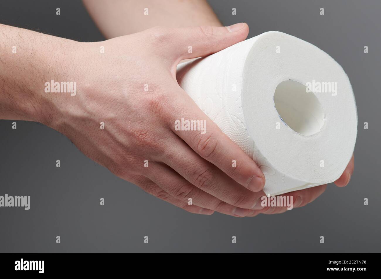Hand on toilet paper hi-res stock photography and images - Alamy