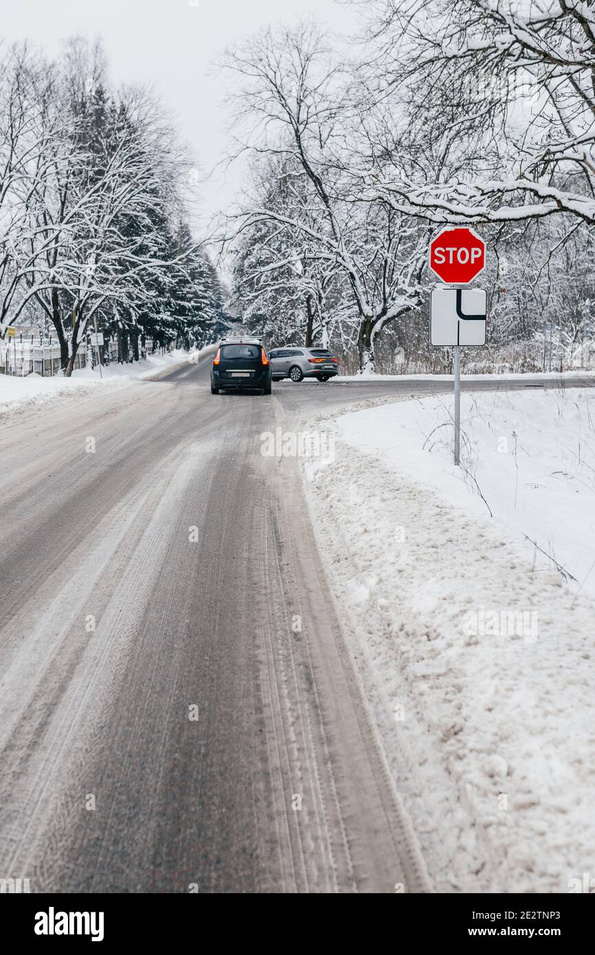 Car collision at the crossroads in winter - snow and ice on the road ...