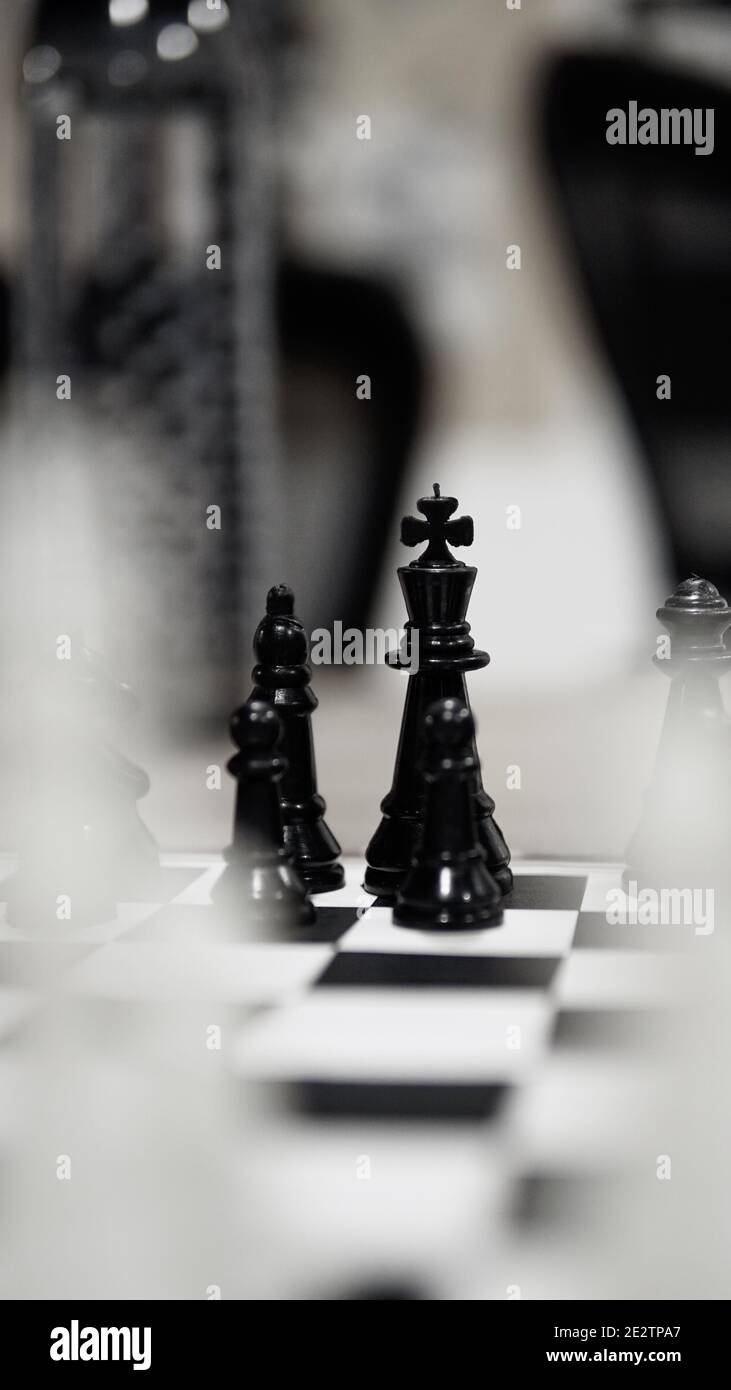 Vertical selective focus shot of black chess pieces on chessboard Stock ...