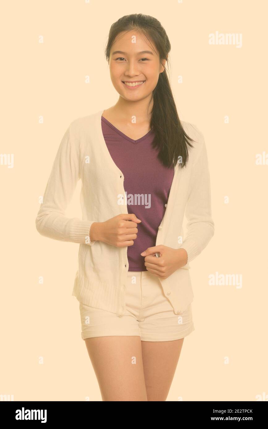 Young happy Asian teenage girl smiling Stock Photo - Alamy