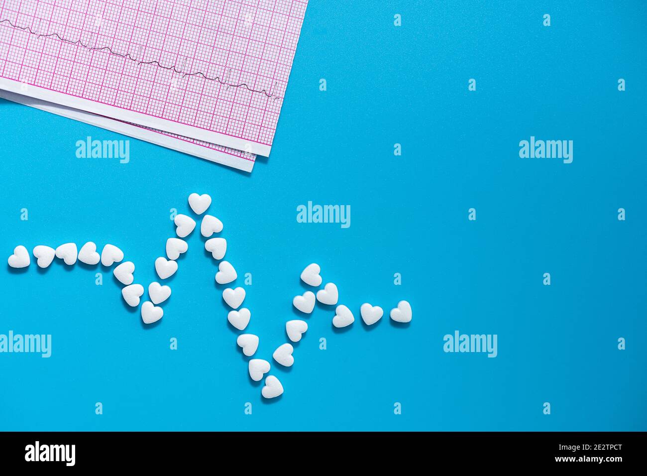 medical topic. Cardiology. electrocardiogram, heart-shaped tablets with ...