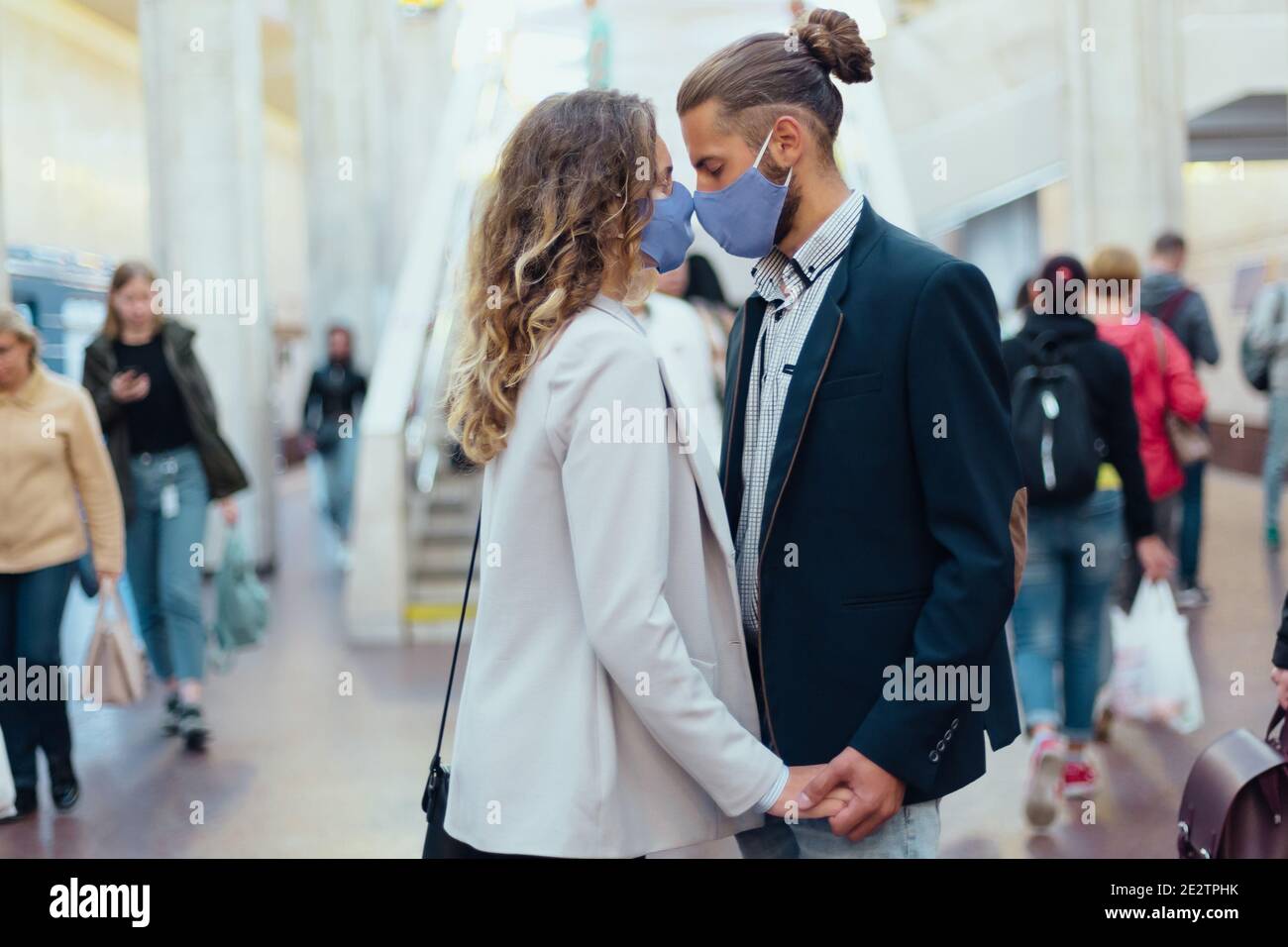 couple in love kissing standing at a subway station Stock Photo - Alamy