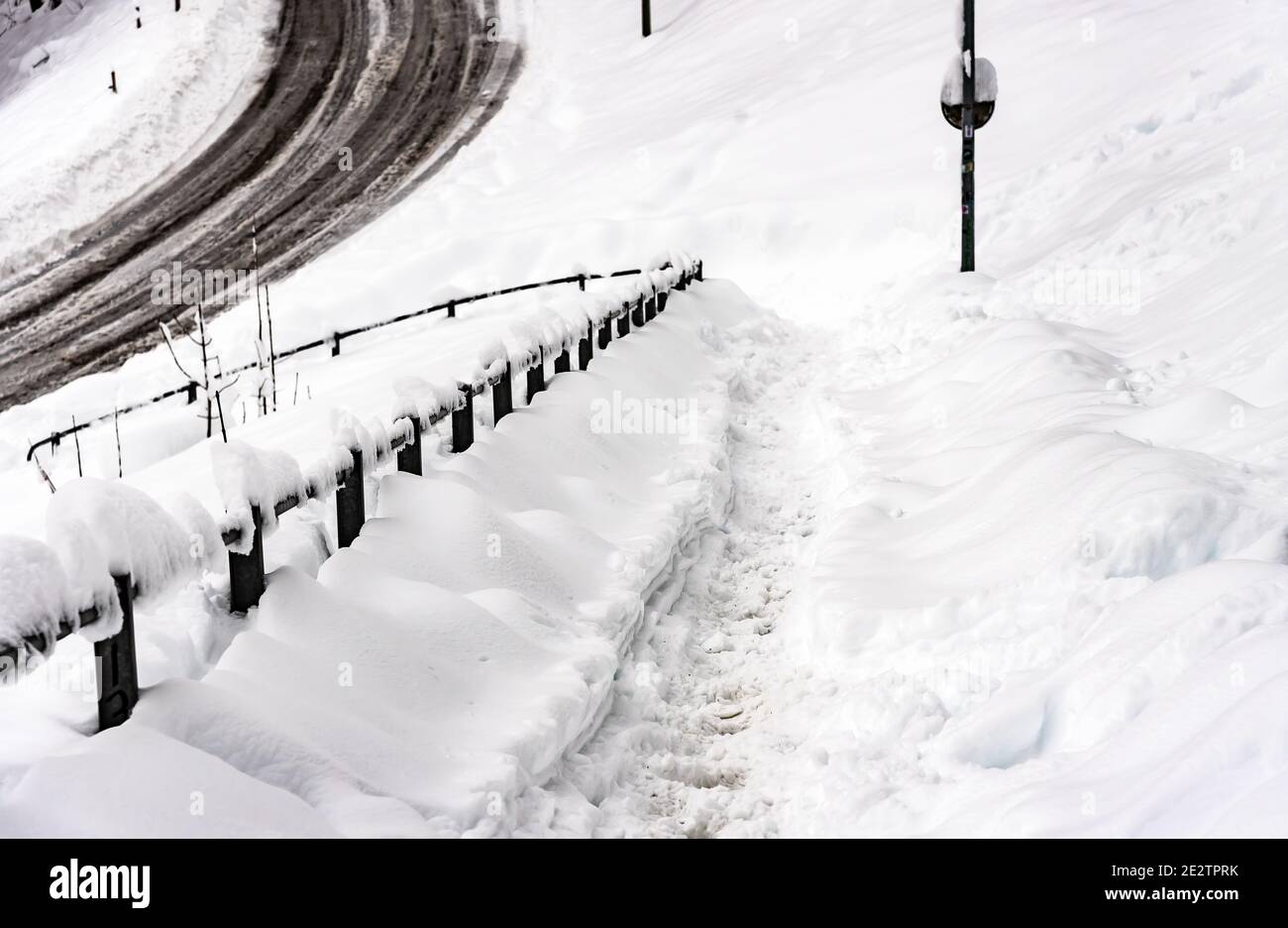 Slippery pedestrian path after snowfall Stock Photo - Alamy