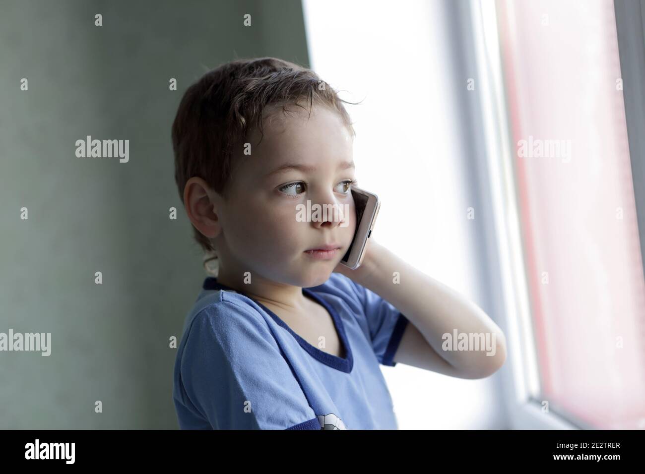 Cute boy looking smartphone screen hi-res stock photography and images ...