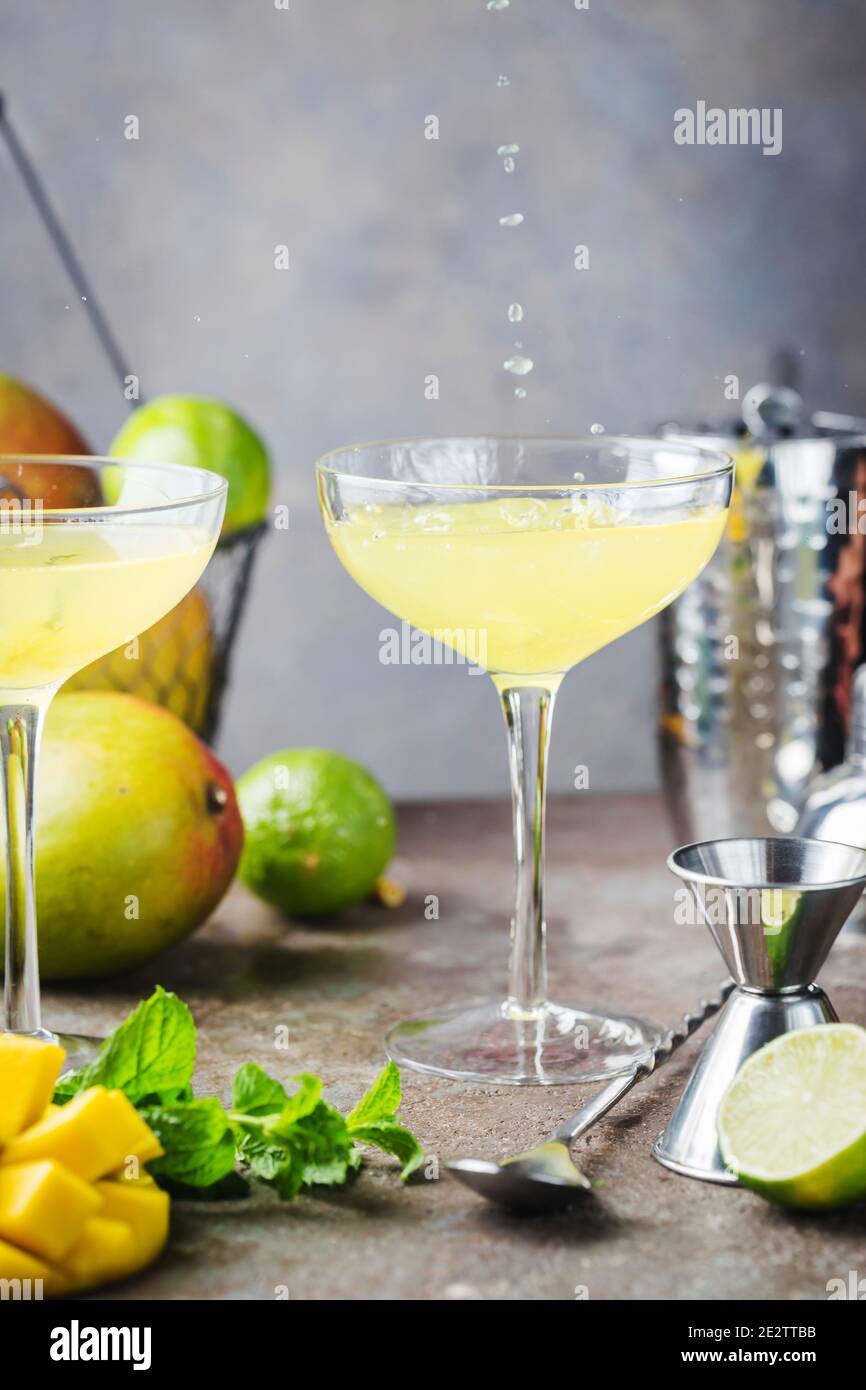 Margarita Mango alcoholic cocktail in a glass on stone background Stock ...