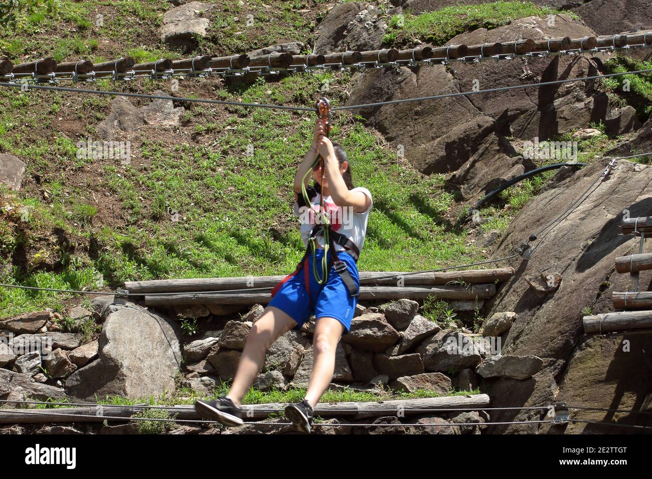 Montestrutto, Italian alps - June 2020: a girl throws herself into a ...