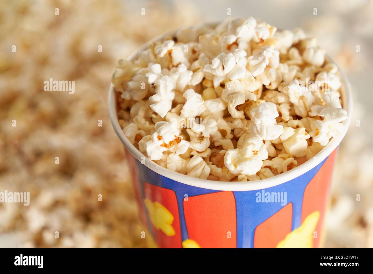 Close up of crispy fried popcorn in striped box. Concept of tasty food ...