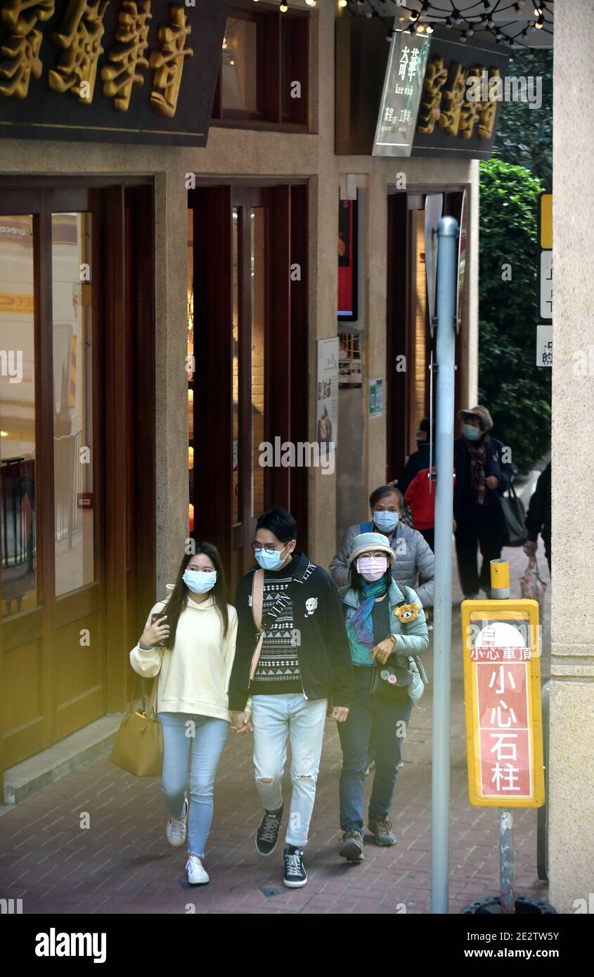 Hong Kong, China. 15th Jan, 2021. Citizens wearing masks walk on a ...