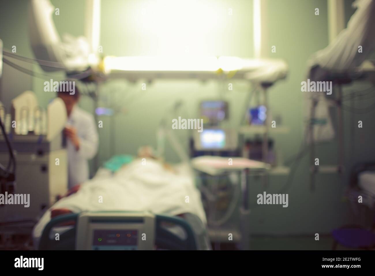 Unfocused background of ICU with doctor and patient Stock Photo - Alamy