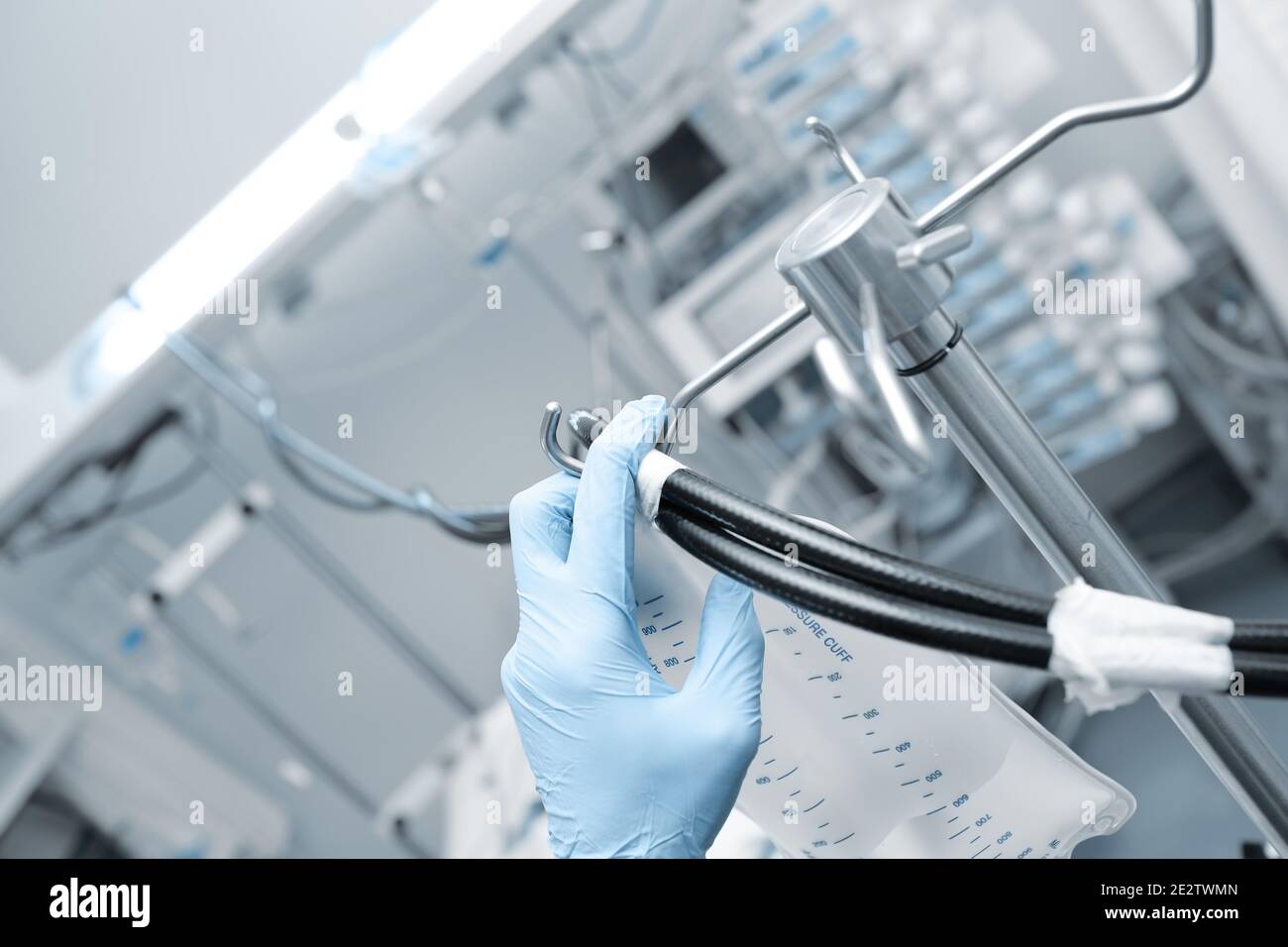 Doctor sets equipment in the ICU Stock Photo - Alamy