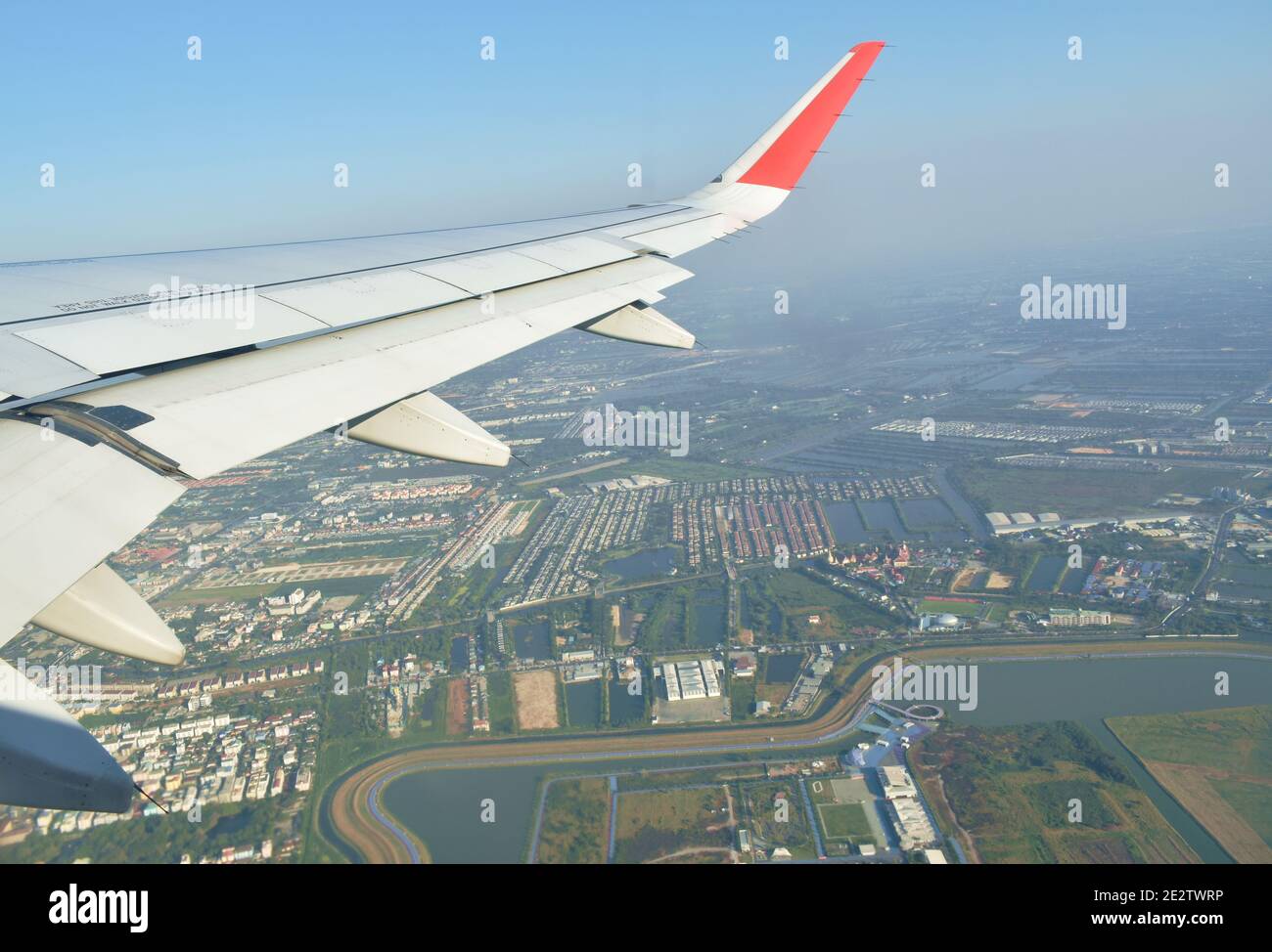 plane wing and cloud floating on sky through window frame Stock Photo ...