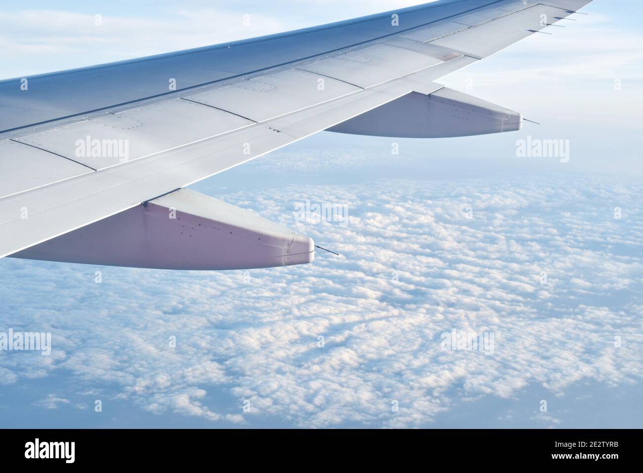 plane wing and cloud floating on sky through window frame Stock Photo ...