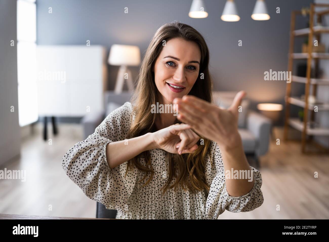 Adult Learning Sign Language For Deaf Disabled Stock Photo - Alamy