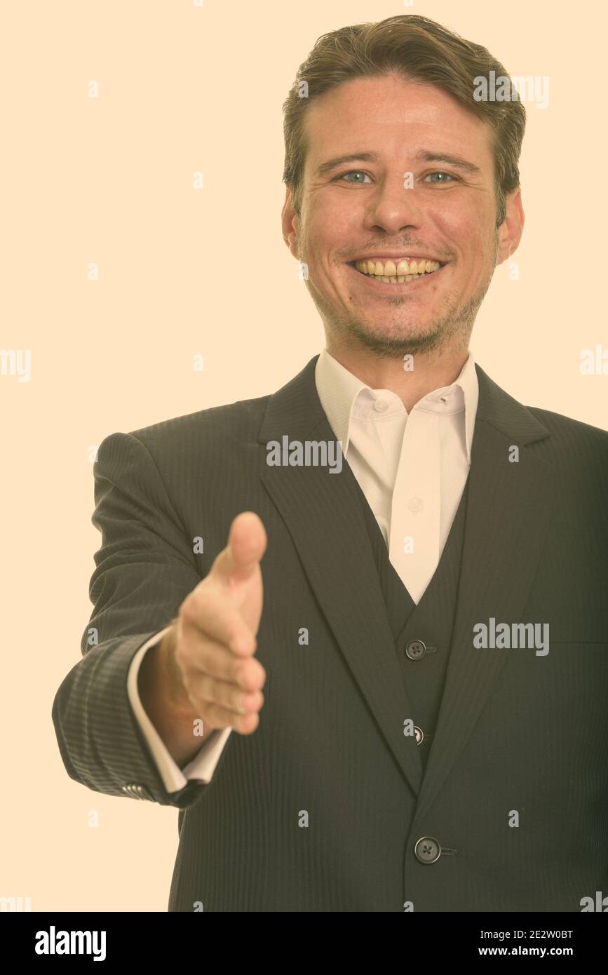 Happy Caucasian businessman giving handshake Stock Photo - Alamy