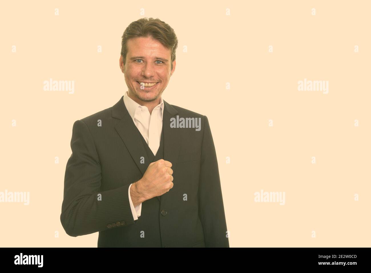 Happy Caucasian businessman looking motivated Stock Photo - Alamy