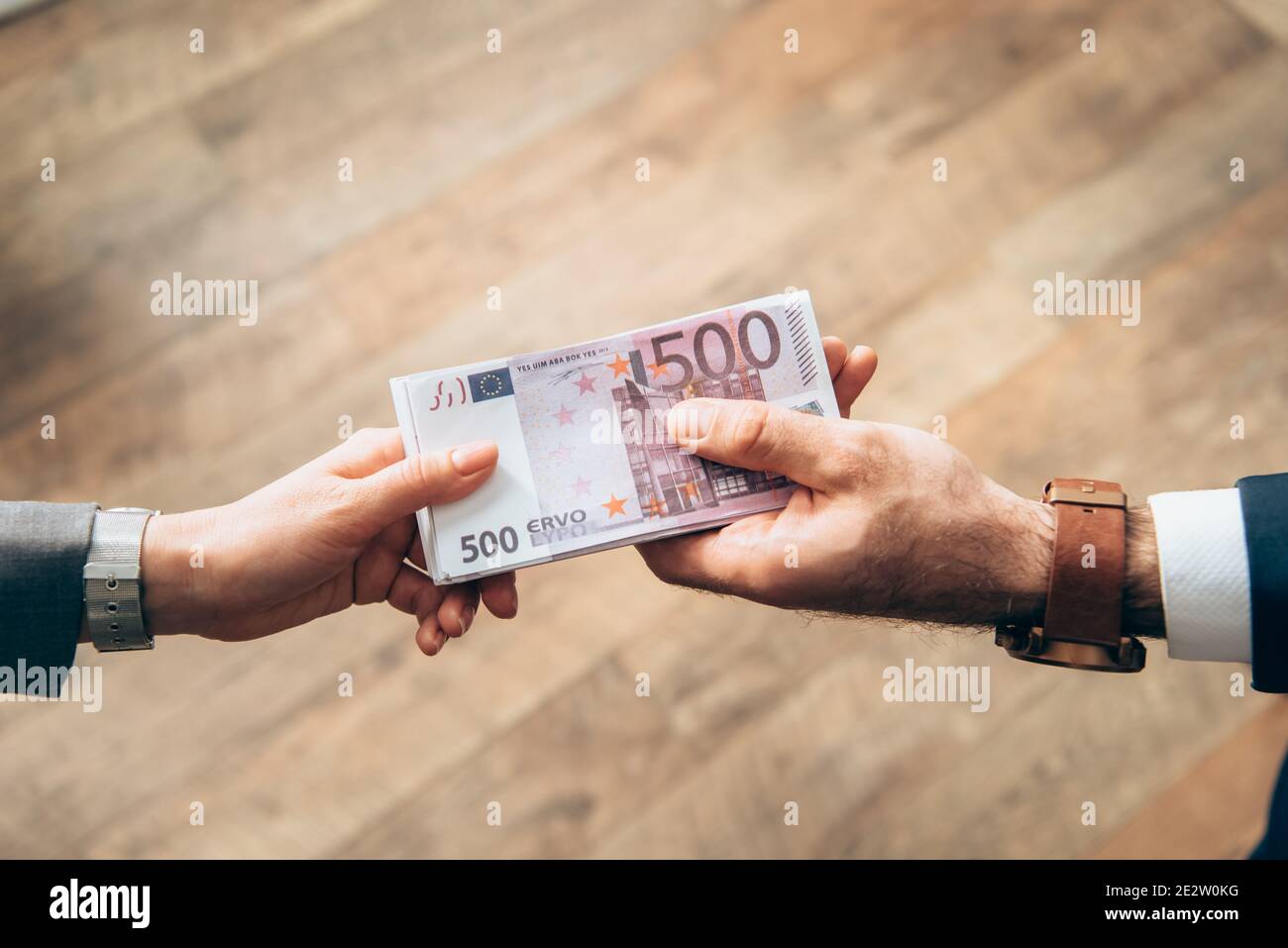 Business man giving euro banknotes hi-res stock photography and images ...
