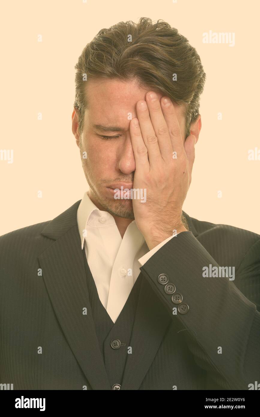 Handsome Caucasian businessman looking sad Stock Photo - Alamy
