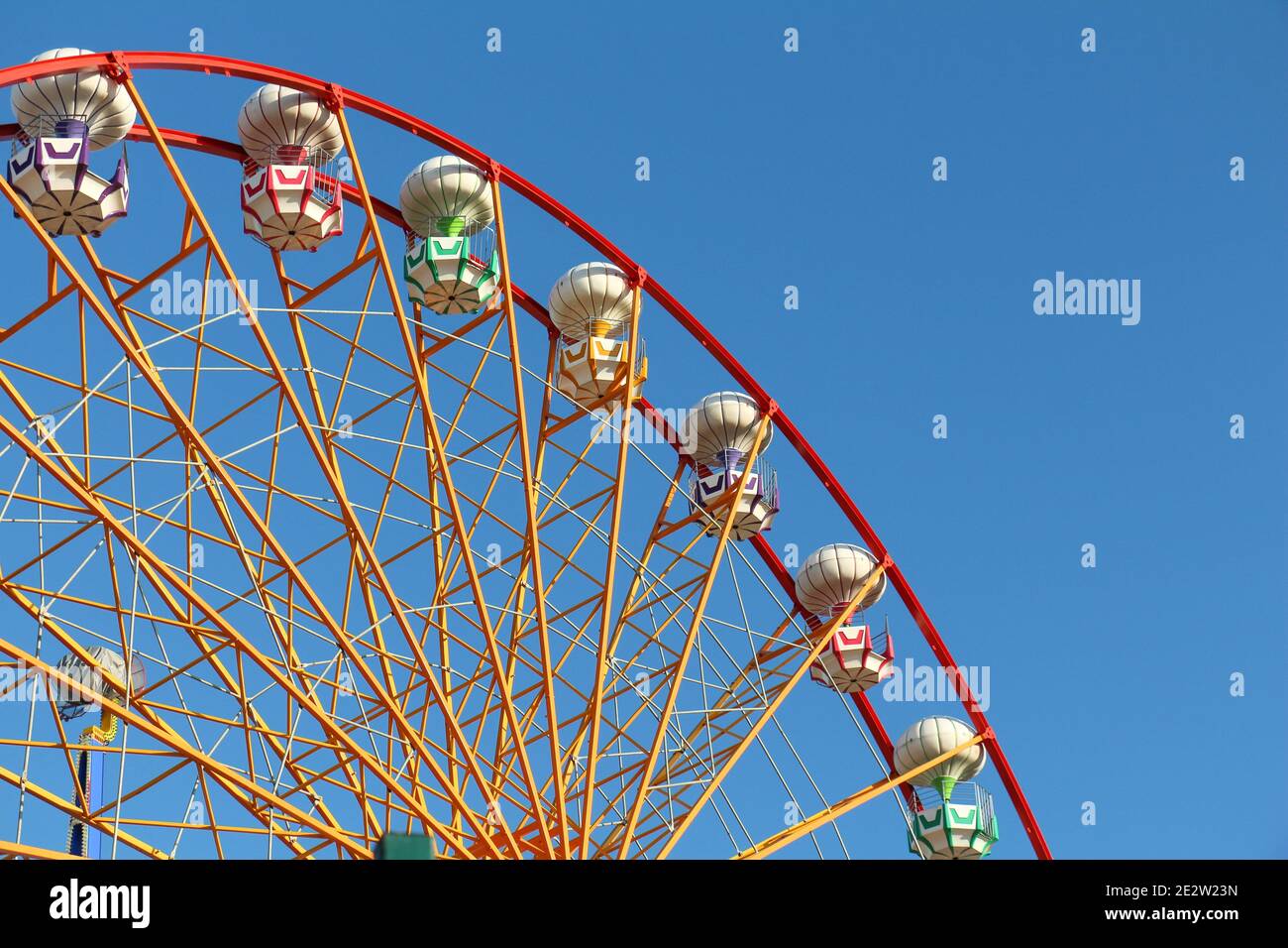 Close up ferris wheel with a blue sky background Stock Photo - Alamy