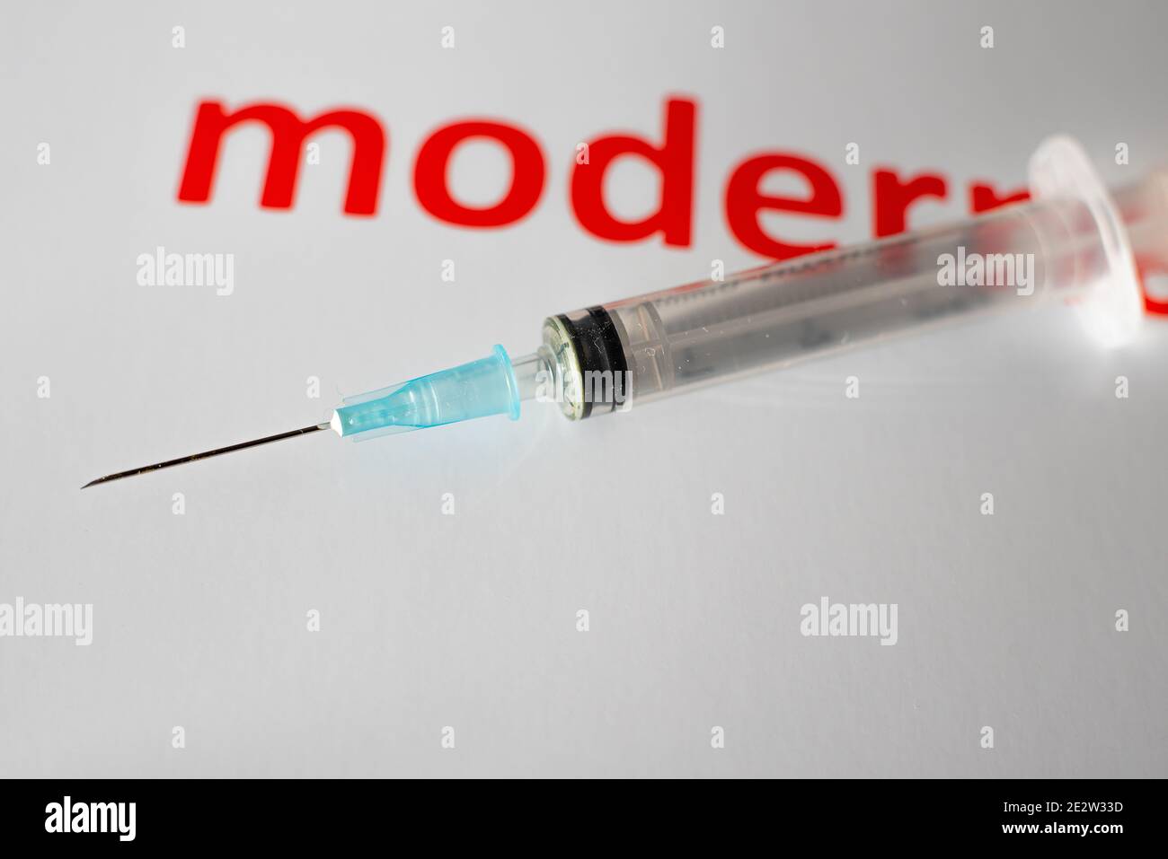 Syringe and moderna sign on white background, Denmark, January 15, 2021 ...