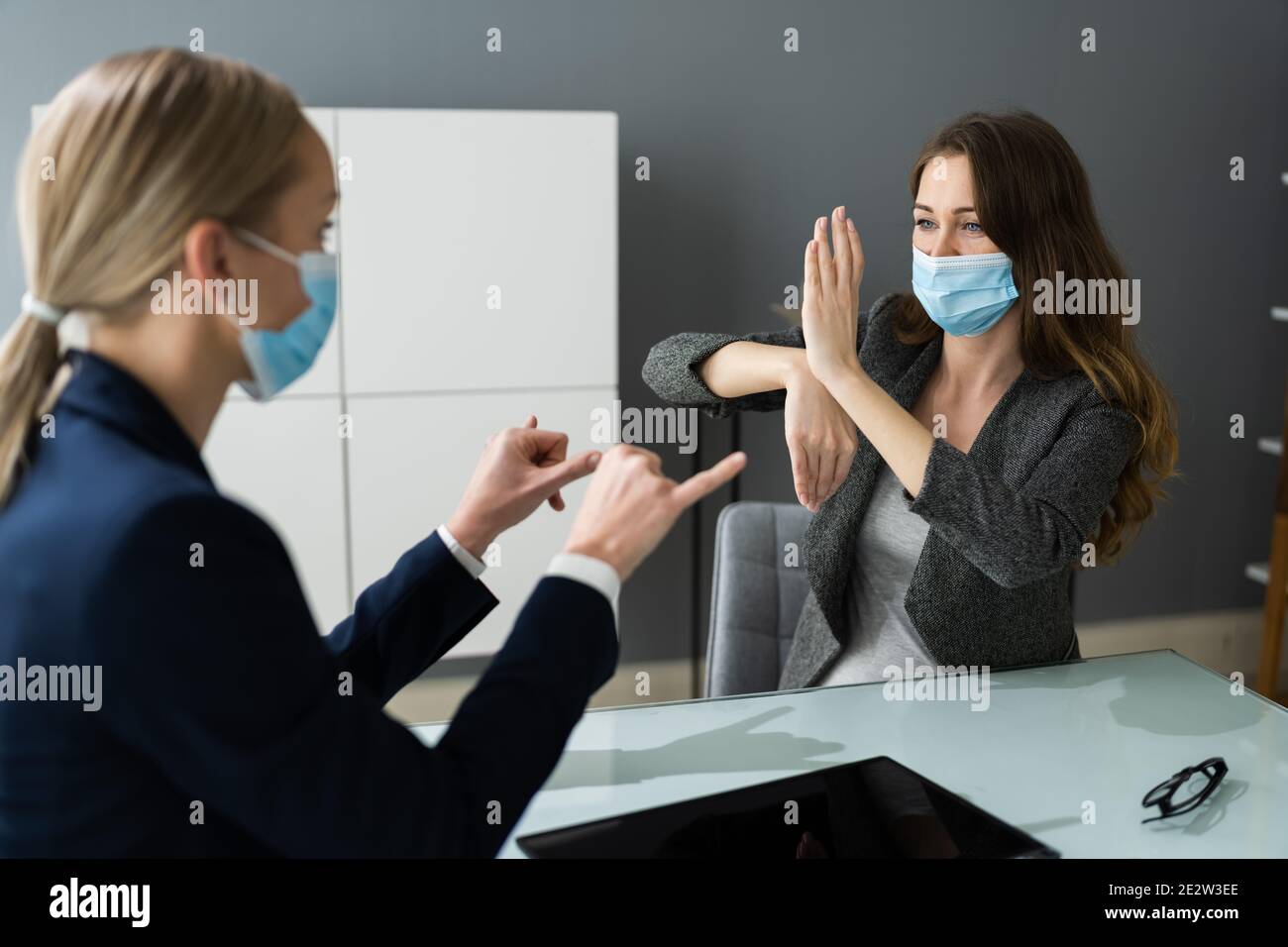 Learning Deaf Sign Language With Face Mask Stock Photo - Alamy