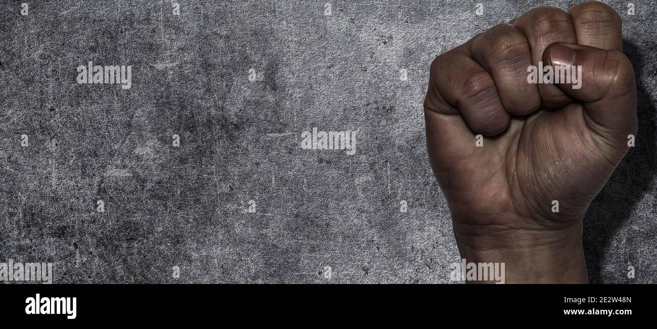 Hand fist on a gray background - black lives matter, BLM, copy space ...