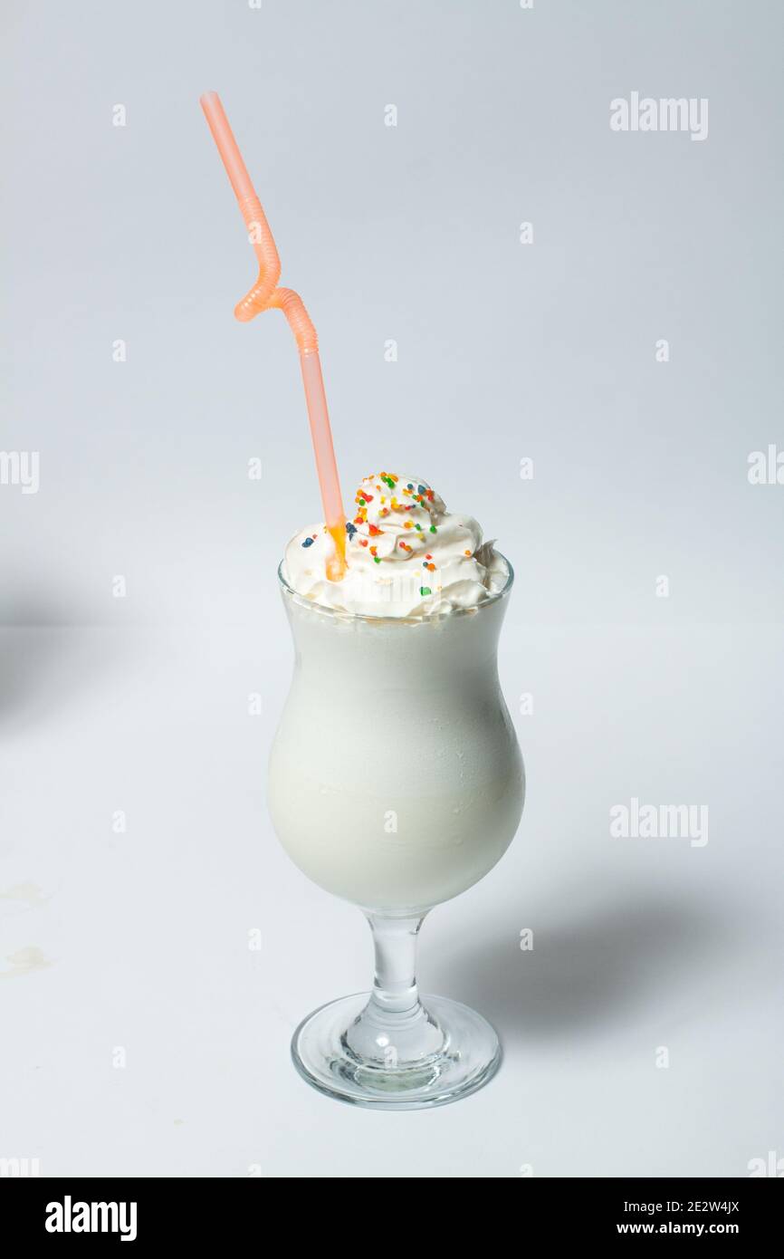 milkshake cocktail with pink straw and marshmallow isolated Stock Photo ...