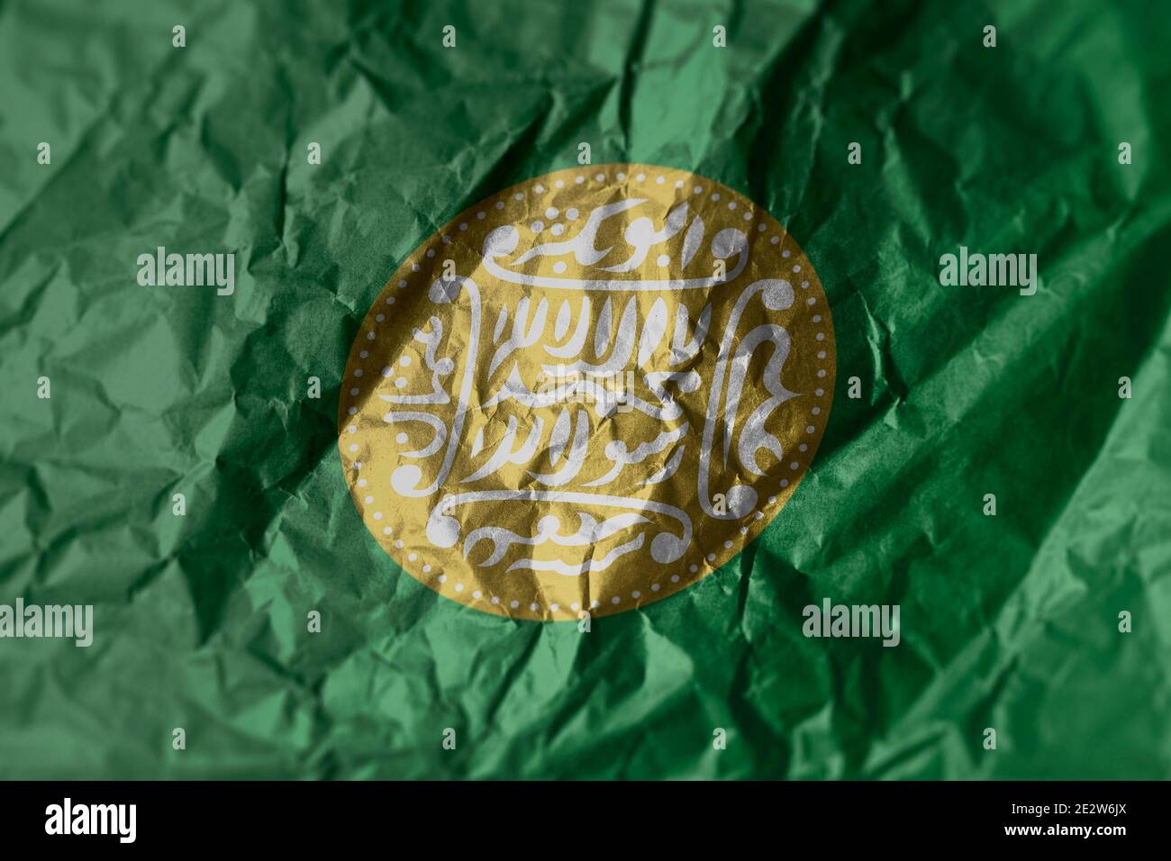 Rohingya flag painted on crumpled paper background Stock Photo - Alamy