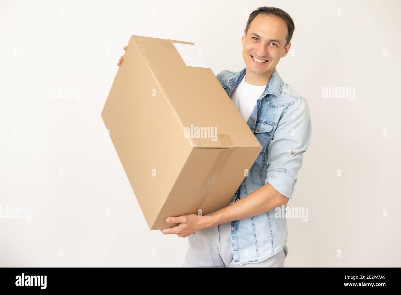 man carries the box, isolated, white background Stock Photo - Alamy