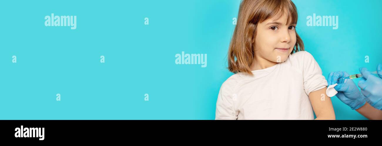 The child is injected into the arm. Selective focus Stock Photo - Alamy