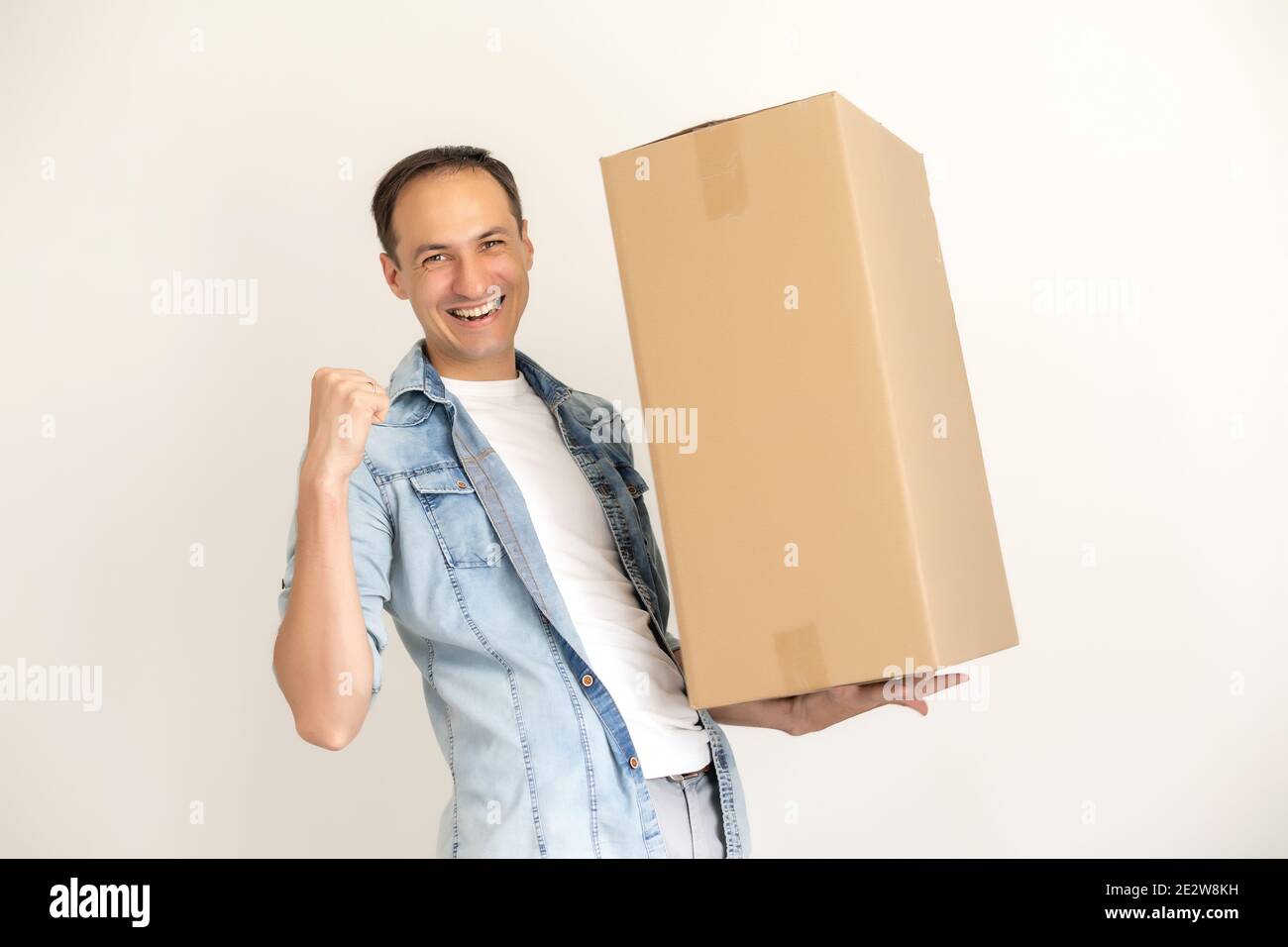 man carries the box, isolated, white background Stock Photo - Alamy
