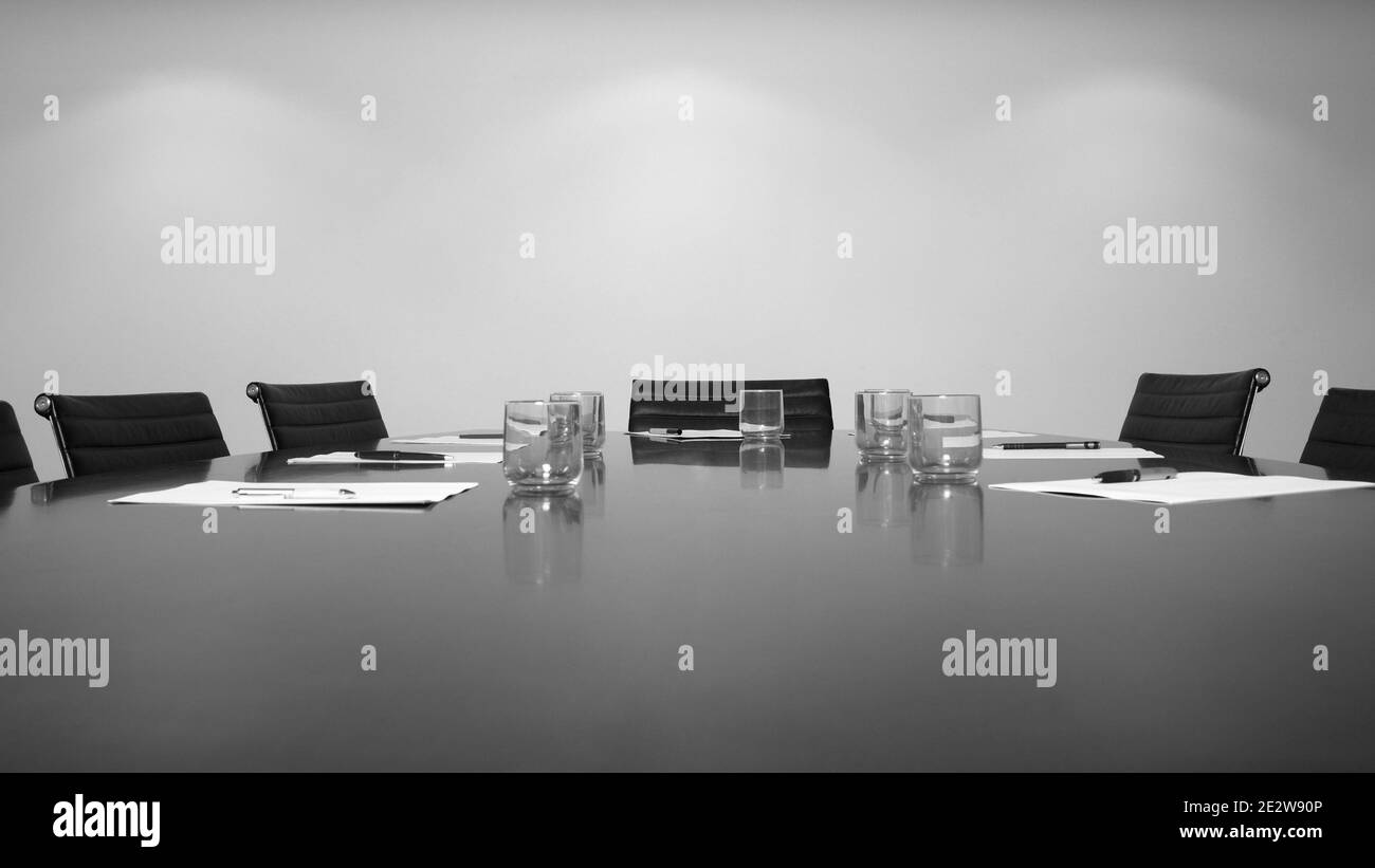 Conference room with arranged water glass and documents at table Stock ...