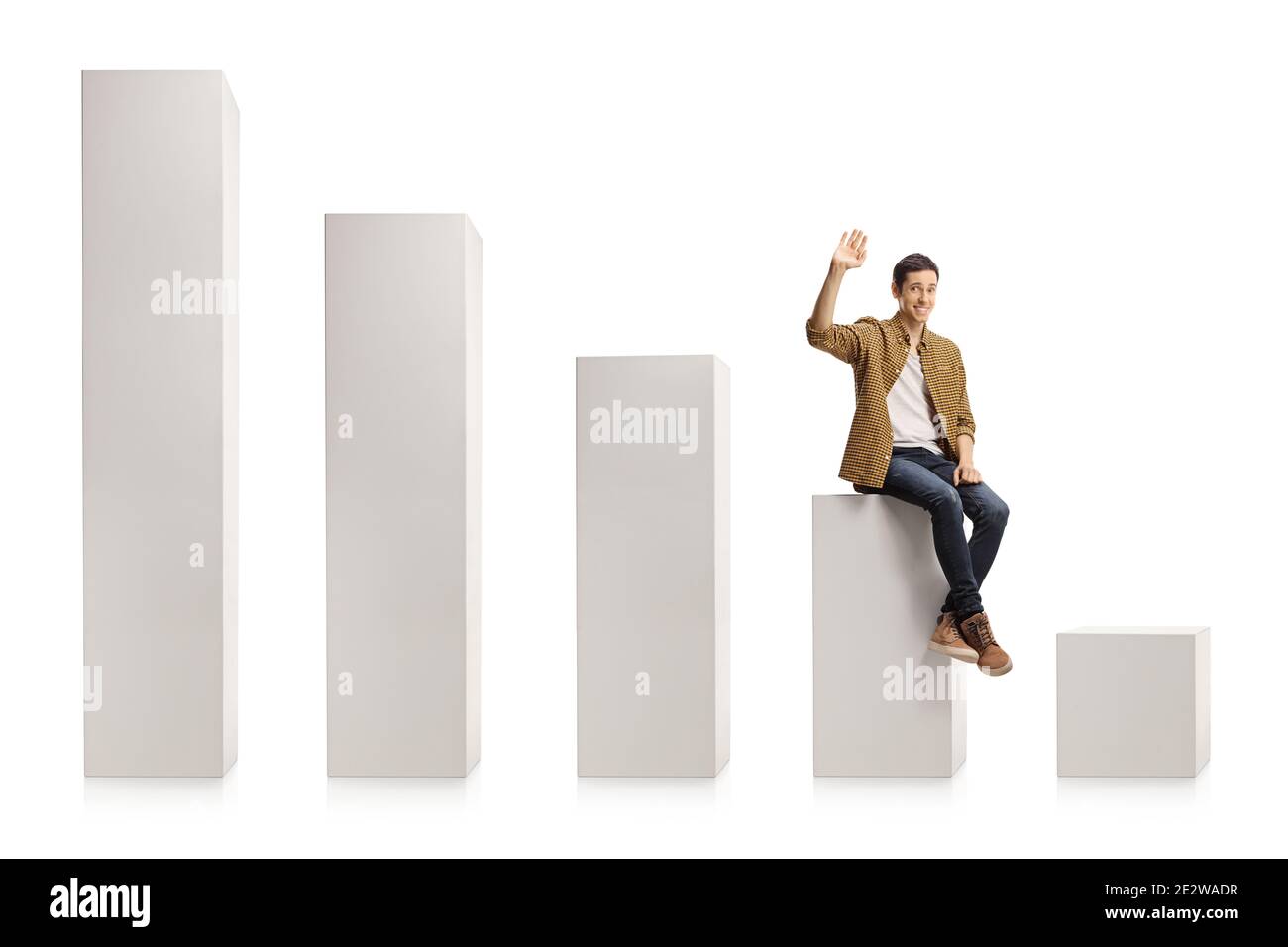 Young casual man sitting on a chart graph and smiling isolated on white ...