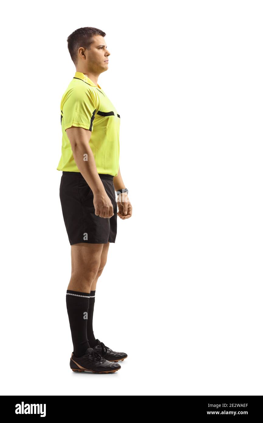 Full length profile shot of a serious footall referee isolated on white ...