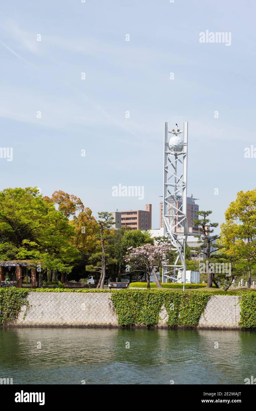 Peace Clock Tower, viewed from across the river, with sky above ...