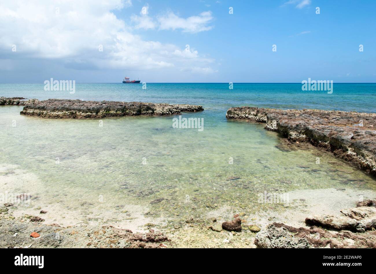 The rocky landscape and crystal clear waters on Grand Cayman island ...