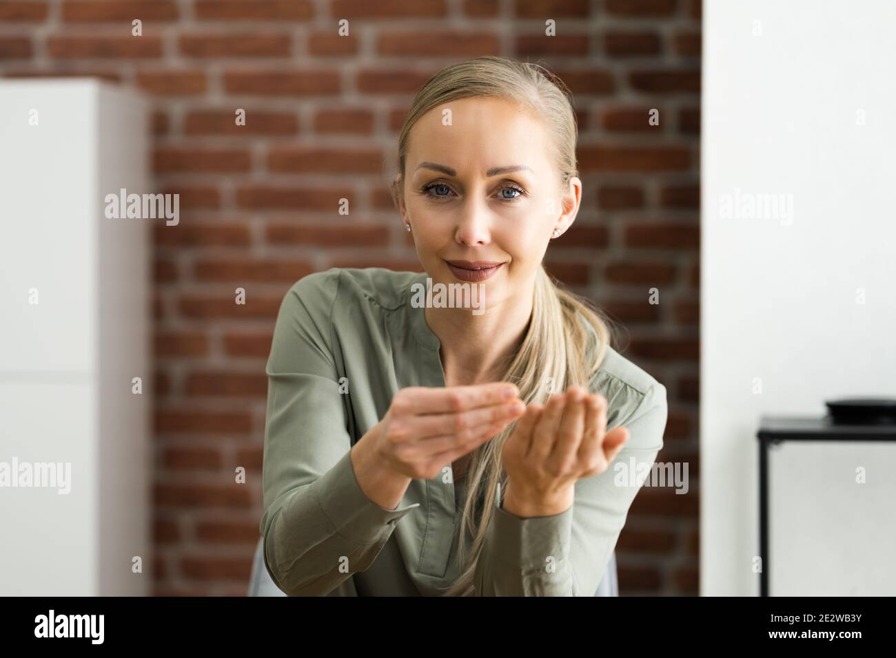 Adult Learning Sign Language For Deaf Disabled Stock Photo - Alamy