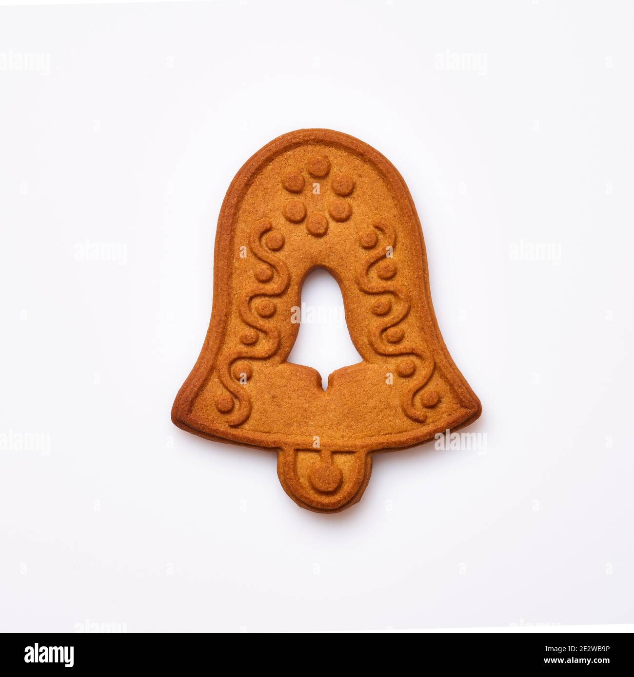 New Year gingerbread or Christmas bell shaped cookies isolated on white ...