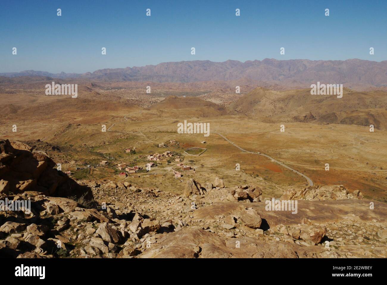 A small rural village in the vast landscape of the Moroccan rock desert ...