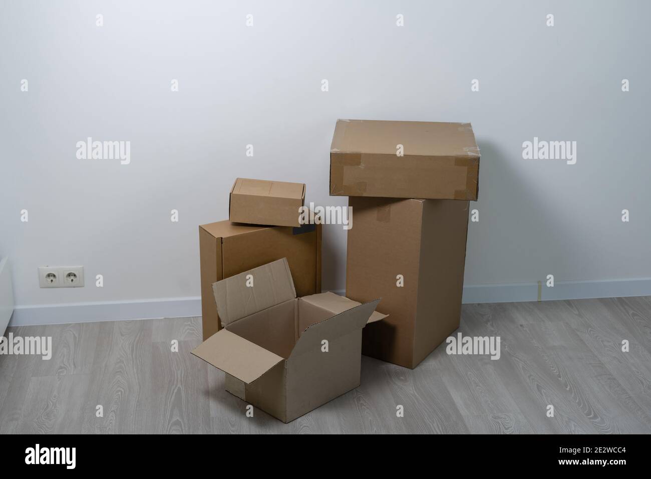 stack of cardboard boxes on white background Stock Photo - Alamy