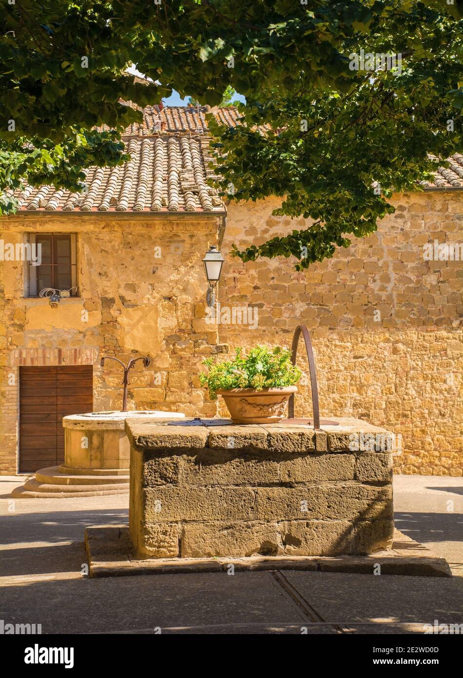 A closed well in an historic square in the centre of the medieval town ...