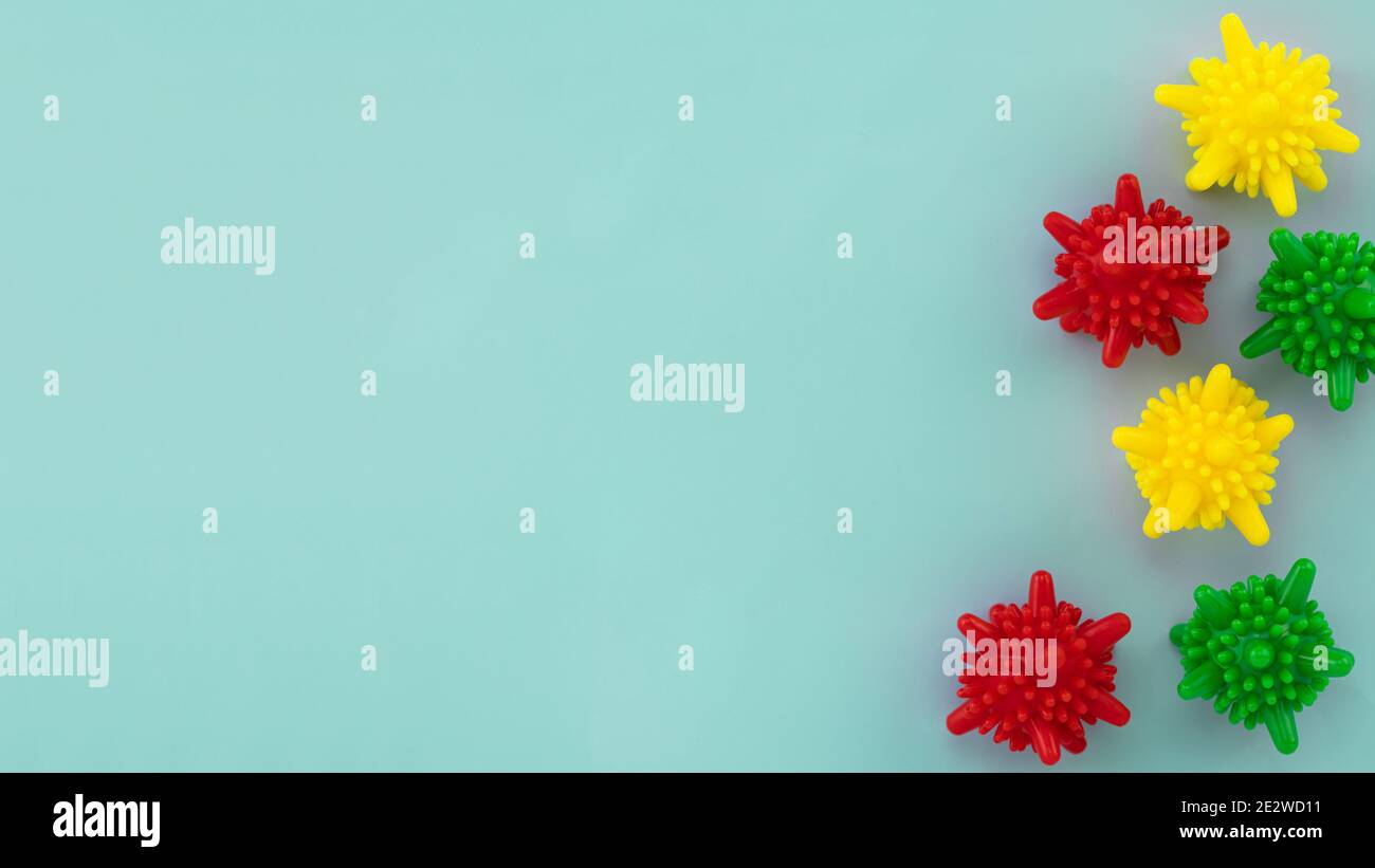 multicolored balloons coronavirus symbol on blue background with copy ...