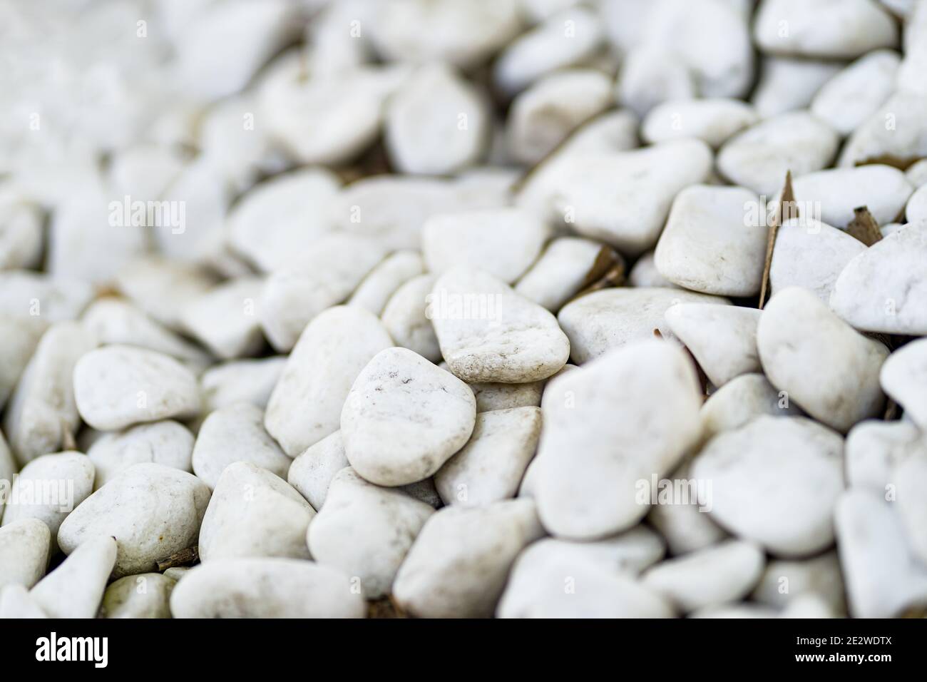 White pebbles stone texture and background Stock Photo - Alamy