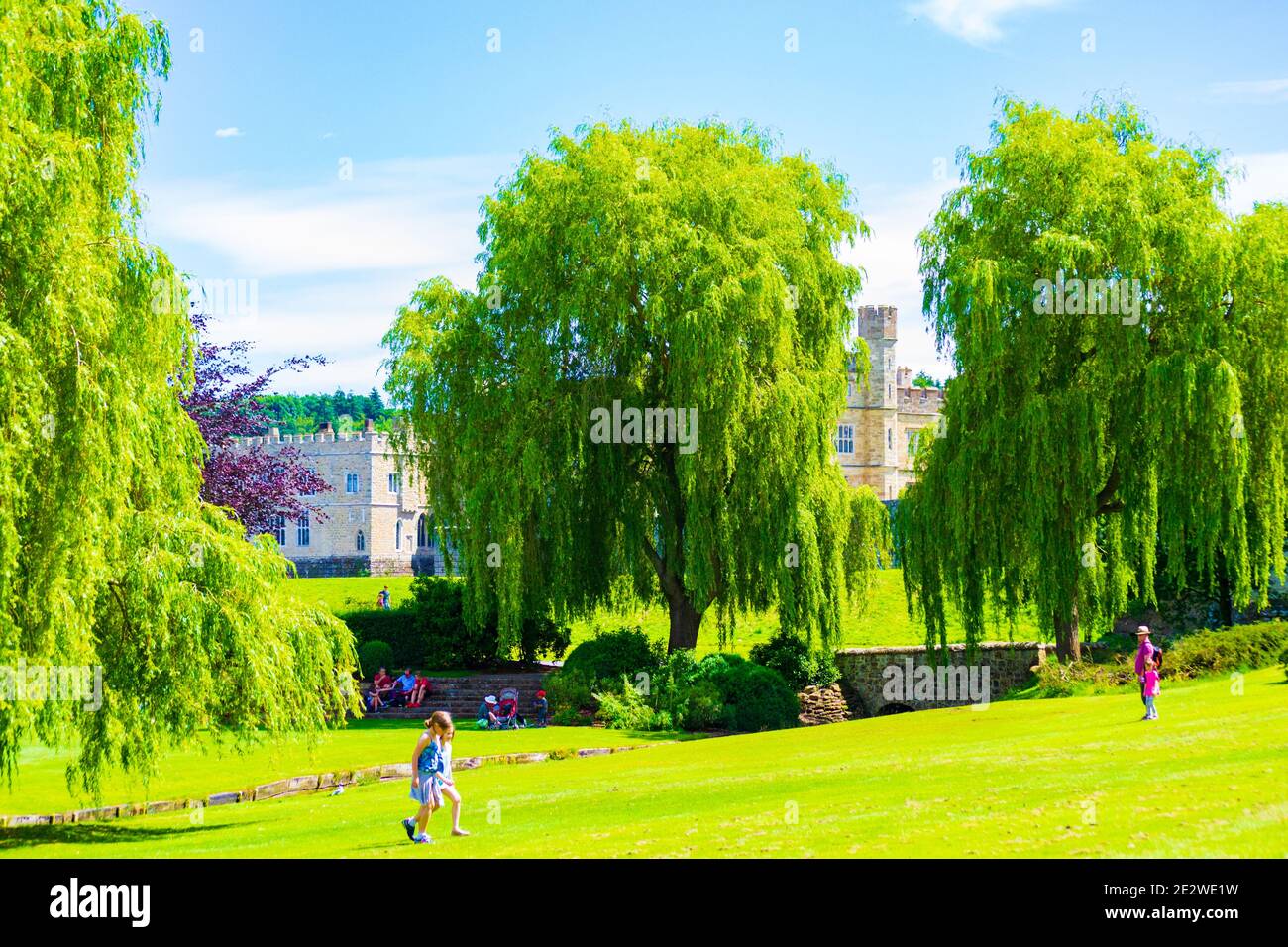 View of Leeds Castle grounds,tourists sightseeing in the gardens and ...